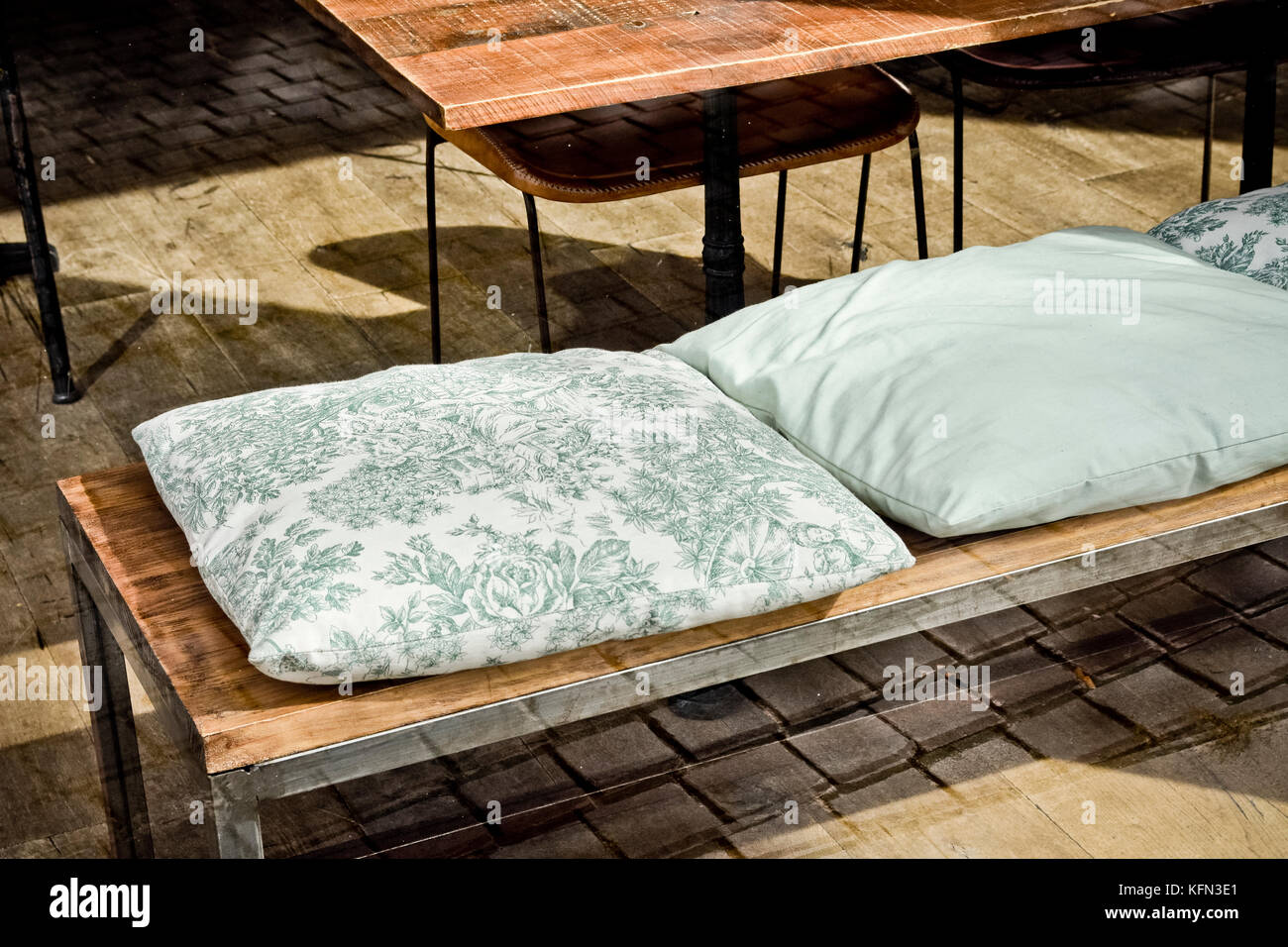 Still life details, pillows on wooden bench Stock Photo - Alamy