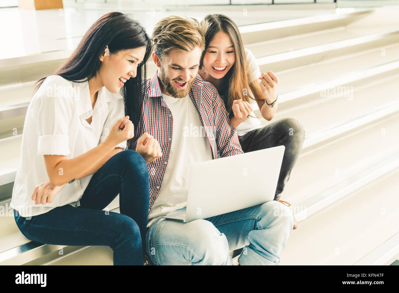 Multiethnic group of college students or young casual freelance team ...