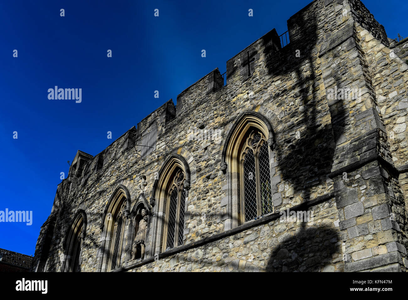The Bargate in Southampton with the shadows of a near by ferris wheel ...