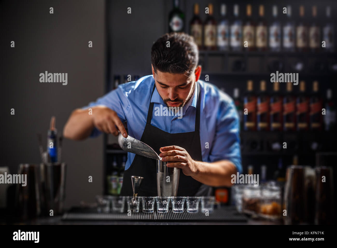 Bartender preparing an alcoholic beverage in a restaurant bar Stock ...