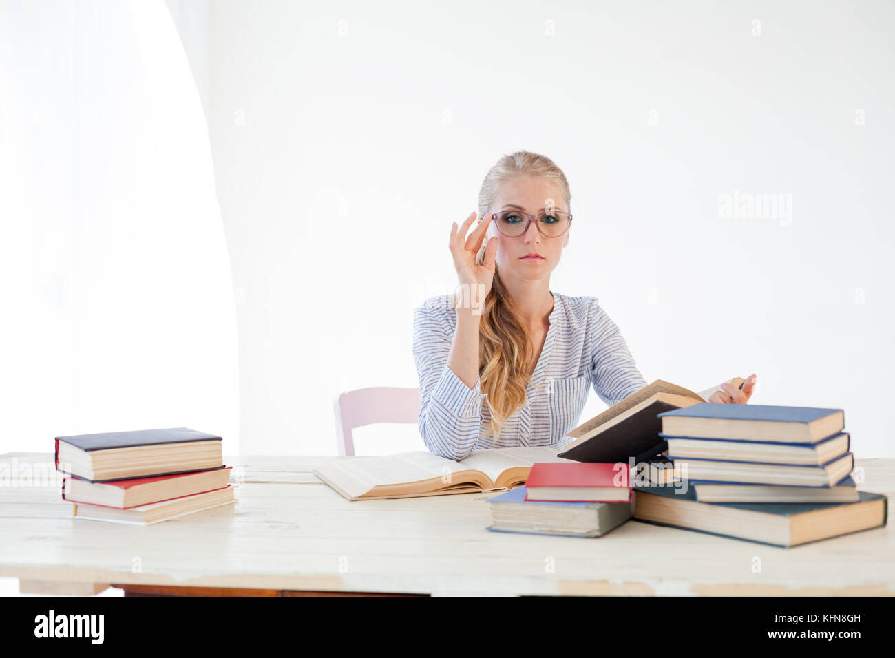 teacher in the Office preparing for the lesson many books Stock Photo ...