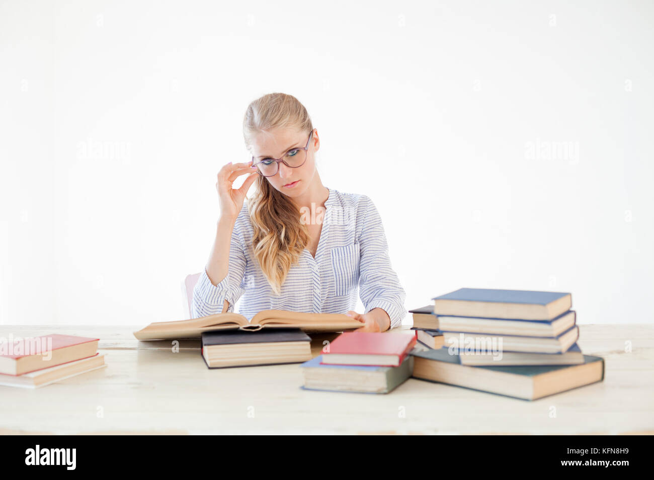 teacher in the Office preparing for the lesson many books Stock Photo ...