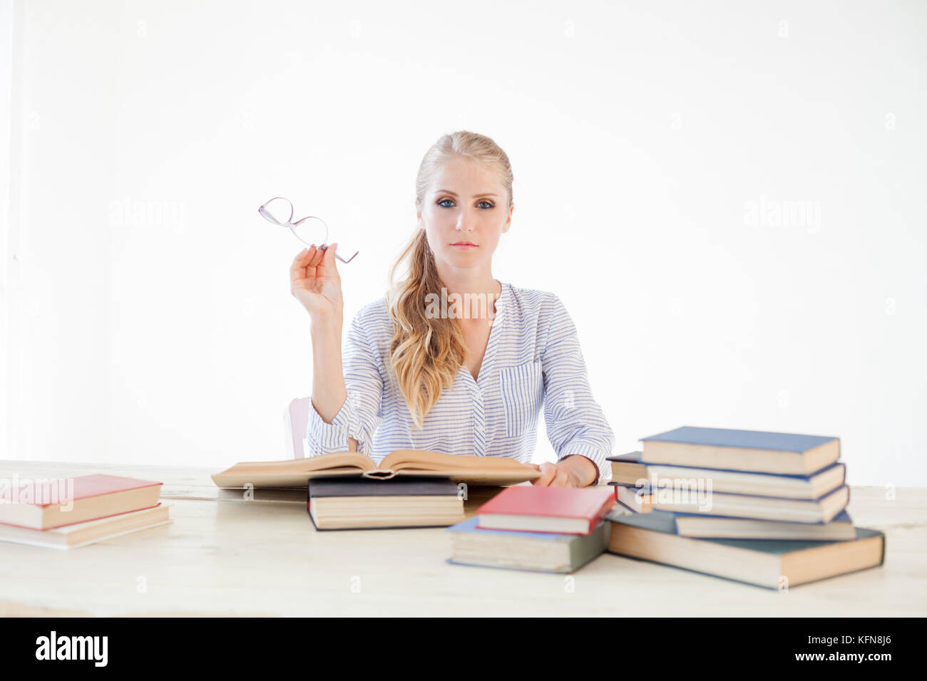 teacher in the Office preparing for the lesson many books Stock Photo ...