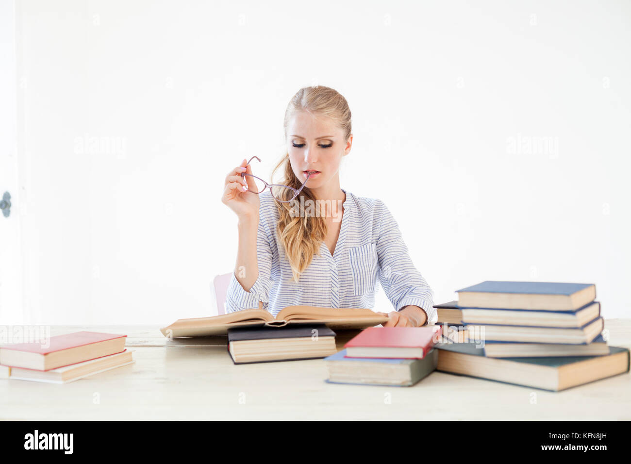 teacher in the Office preparing for the lesson many books Stock Photo ...