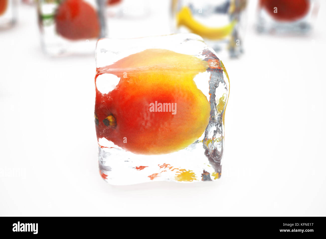 Mango in ice cube isolated on white with depth of field effects. Ice ...