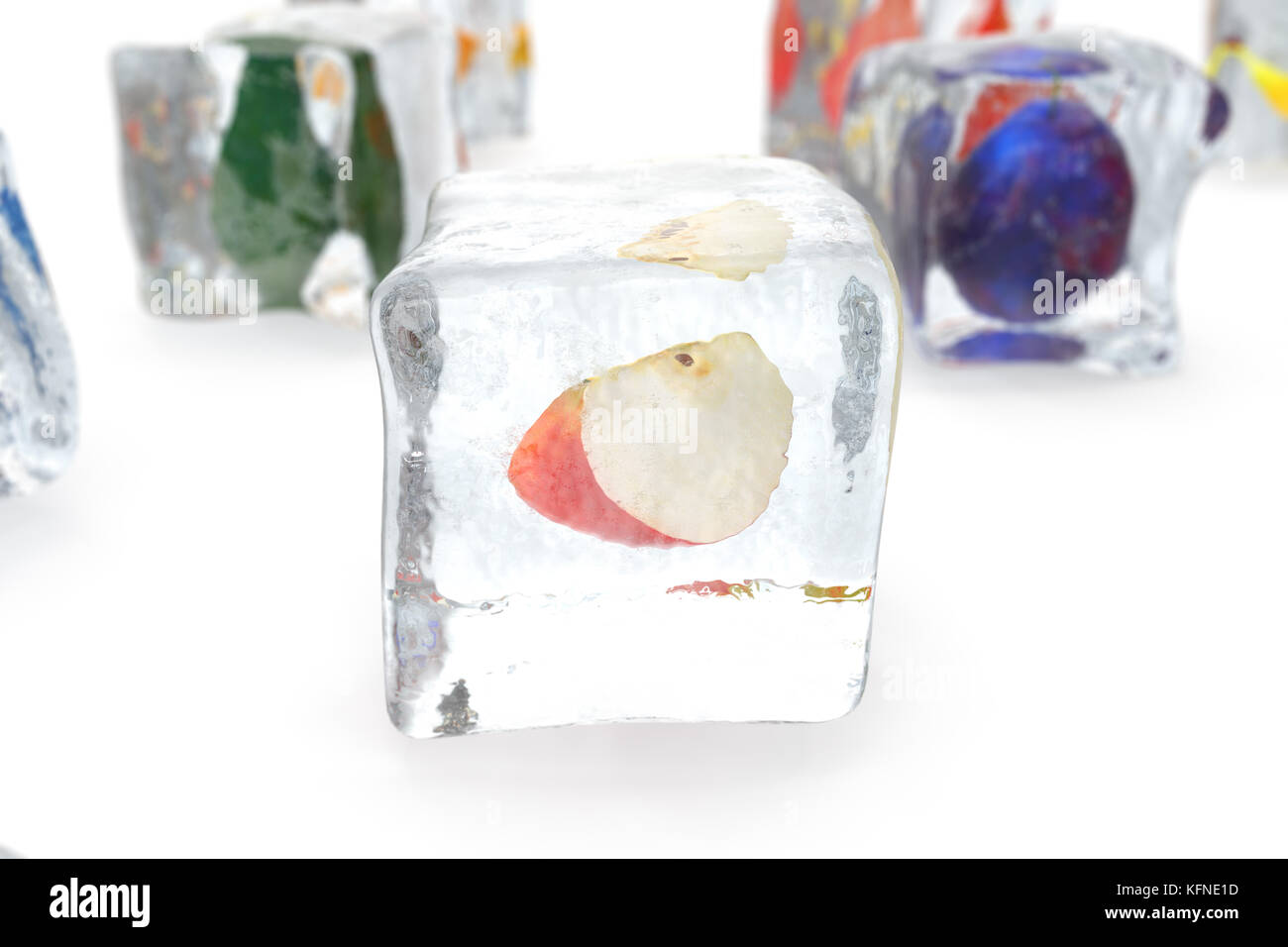 Apple in ice cube isolated on white with depth of field effects. Ice ...