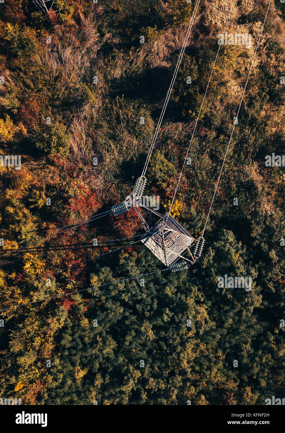 Aerial view of electricity pylon in the field, top view of industrial ...