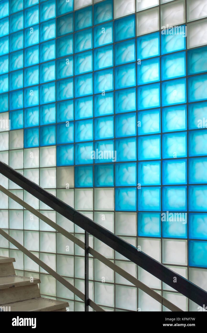 Colored frosted glass blocks corridor with staircase, detail of retro ...