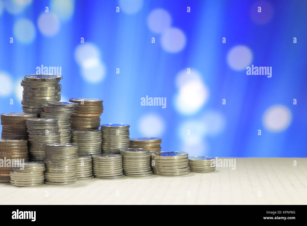 coin stack blue background. Business growth, saving and investment ...