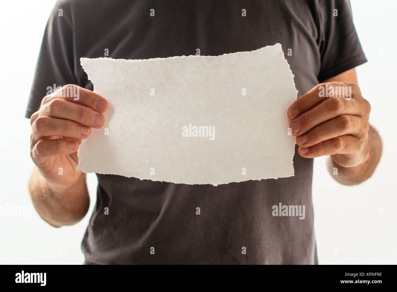 Man holding piece of paper hi-res stock photography and images - Alamy