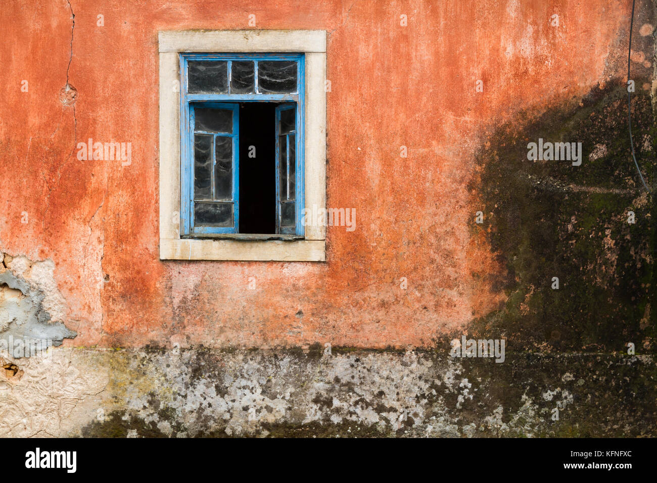 Rusty wood blue window on aged orange wall Stock Photo - Alamy