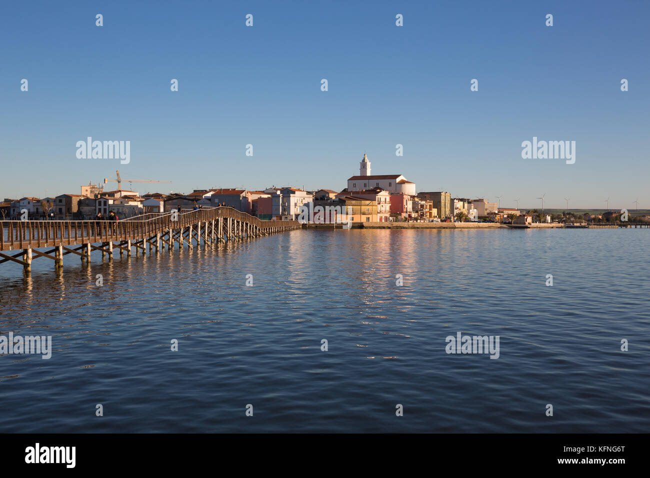 Lesina (Puglia, Italy) - Lesina Lake and the village in the sunset ...