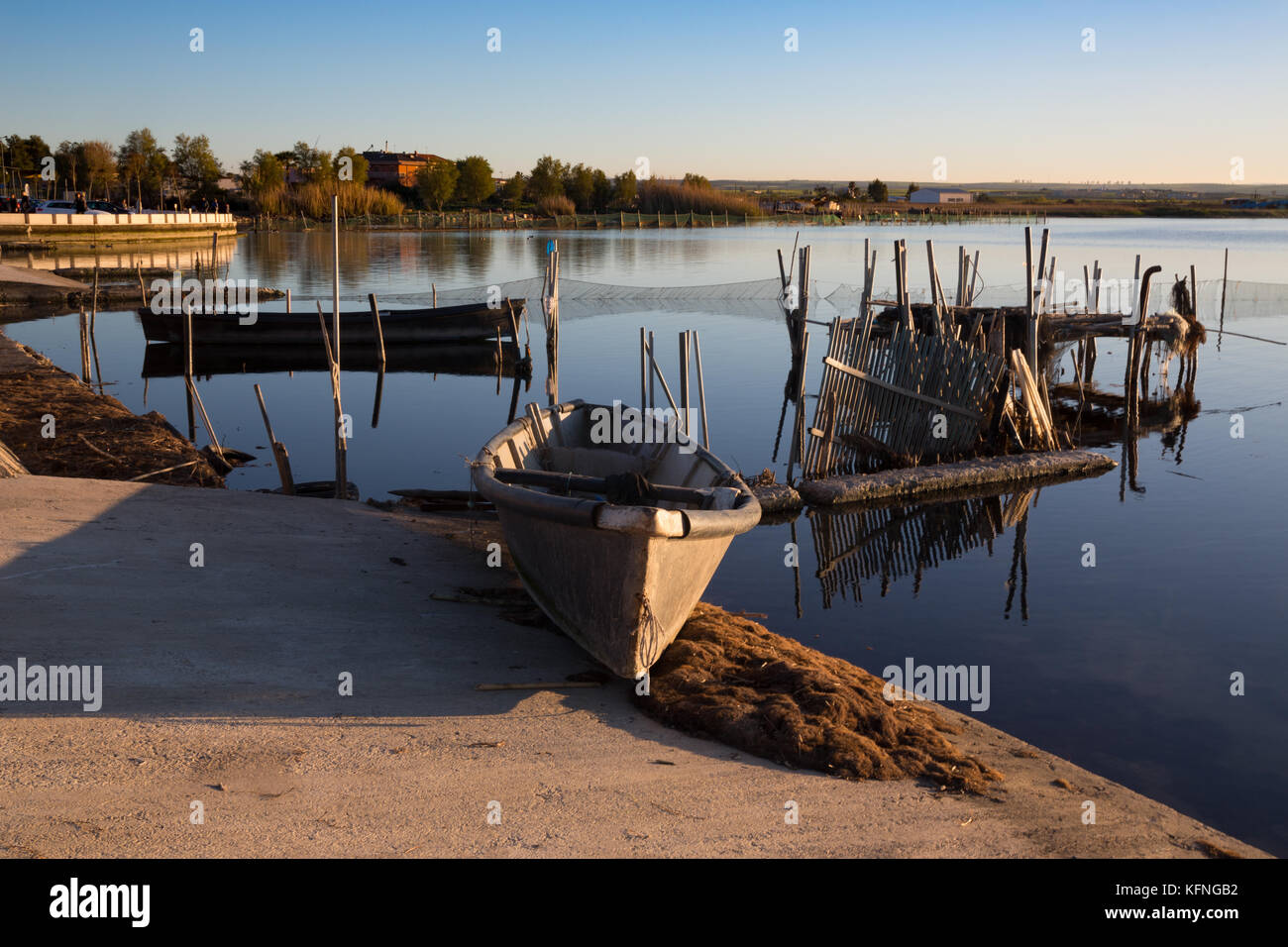 Lesina (Puglia, Italy) - View of the lake and boats in the sunset Stock ...
