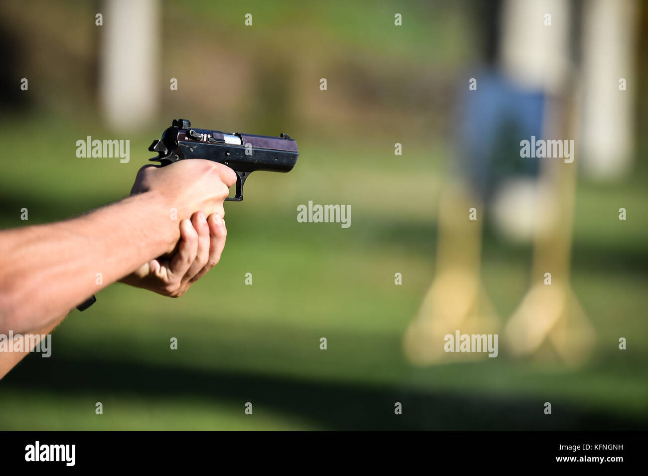 Outdoor shooting with a 9mm pistol in a shooting range Stock Photo - Alamy