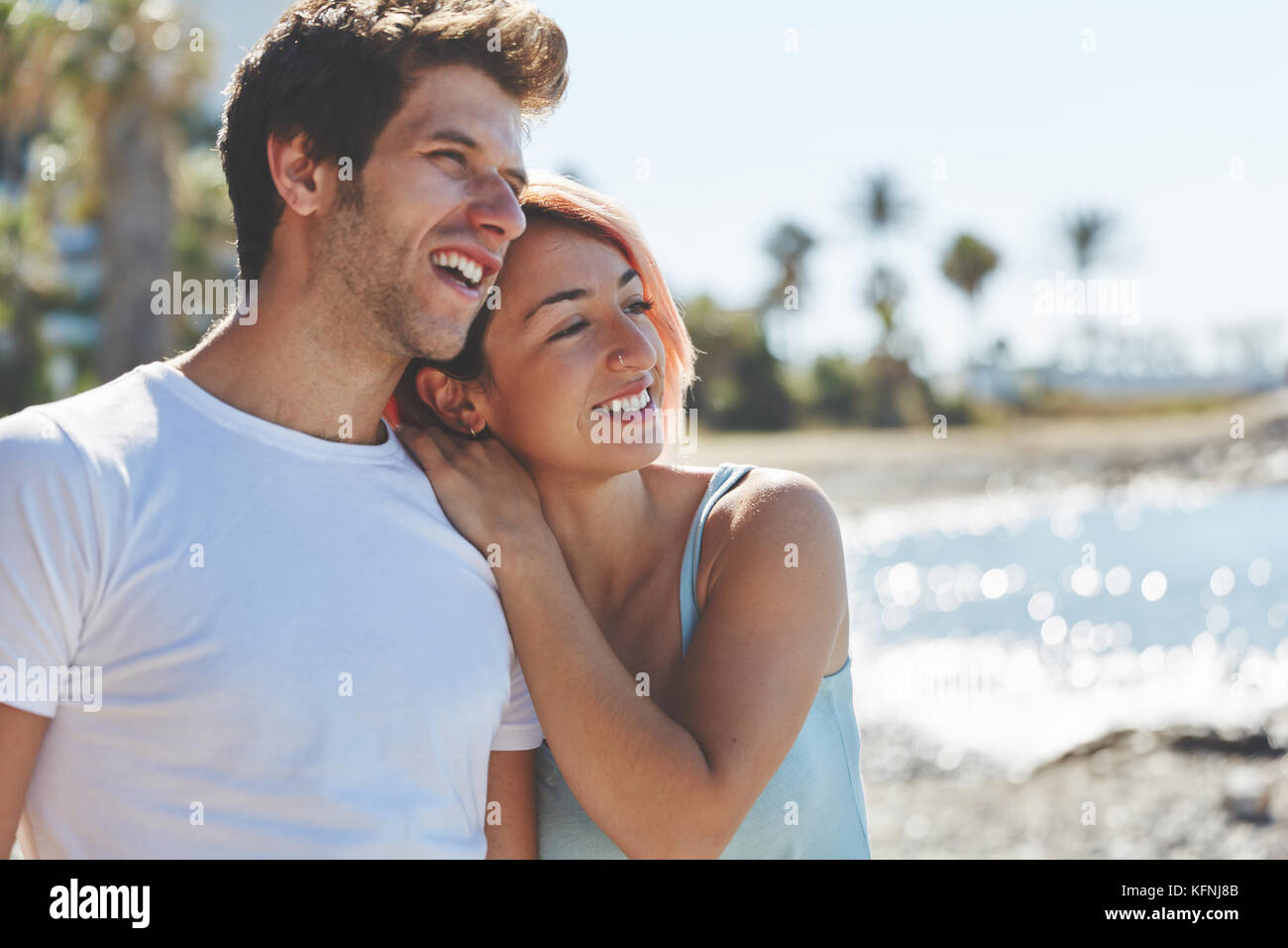 Portrait of happy woman leaning on her boyfriend looking away Stock ...