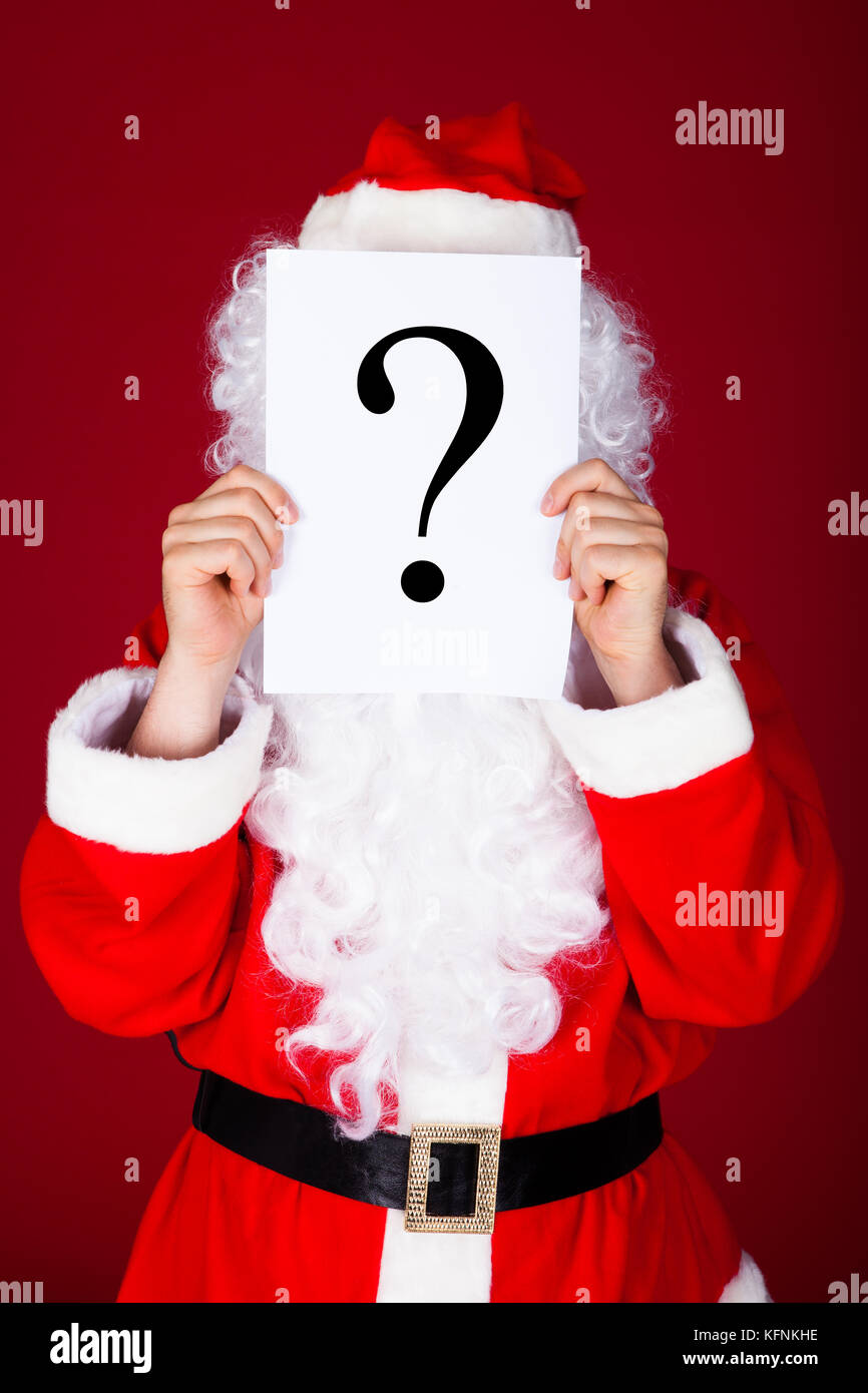 Santa claus portrait hiding face hi-res stock photography and images ...