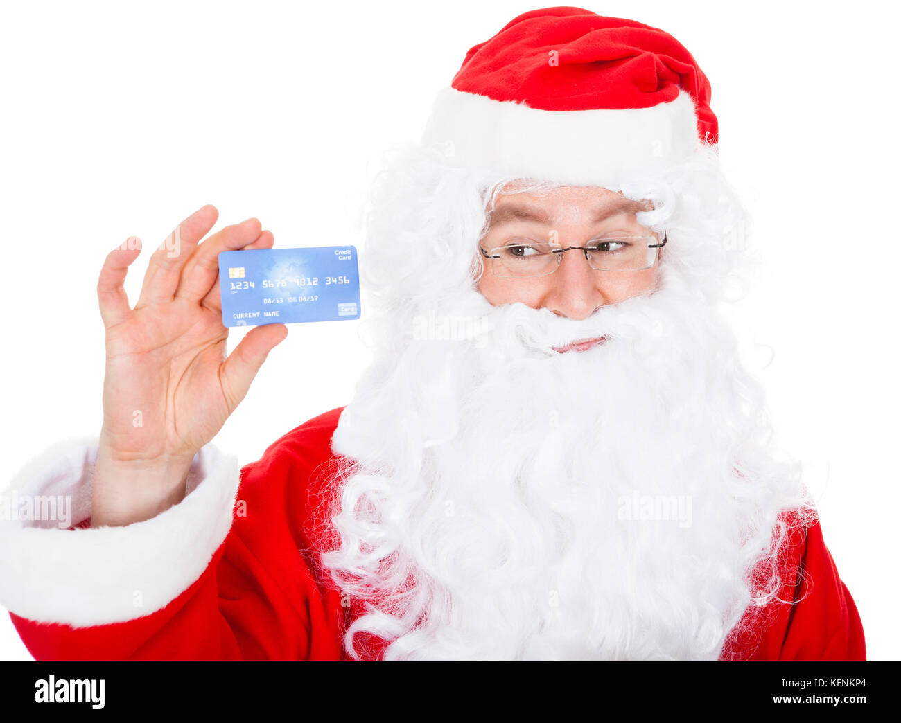 Portrait of santa pointing at credit card over white background Stock ...