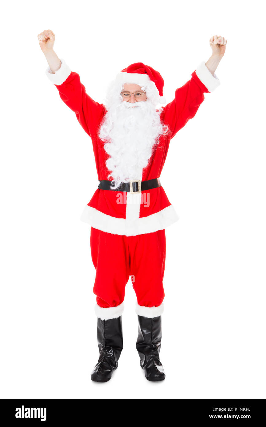 Portrait of excited santa raising his arms on white background Stock ...