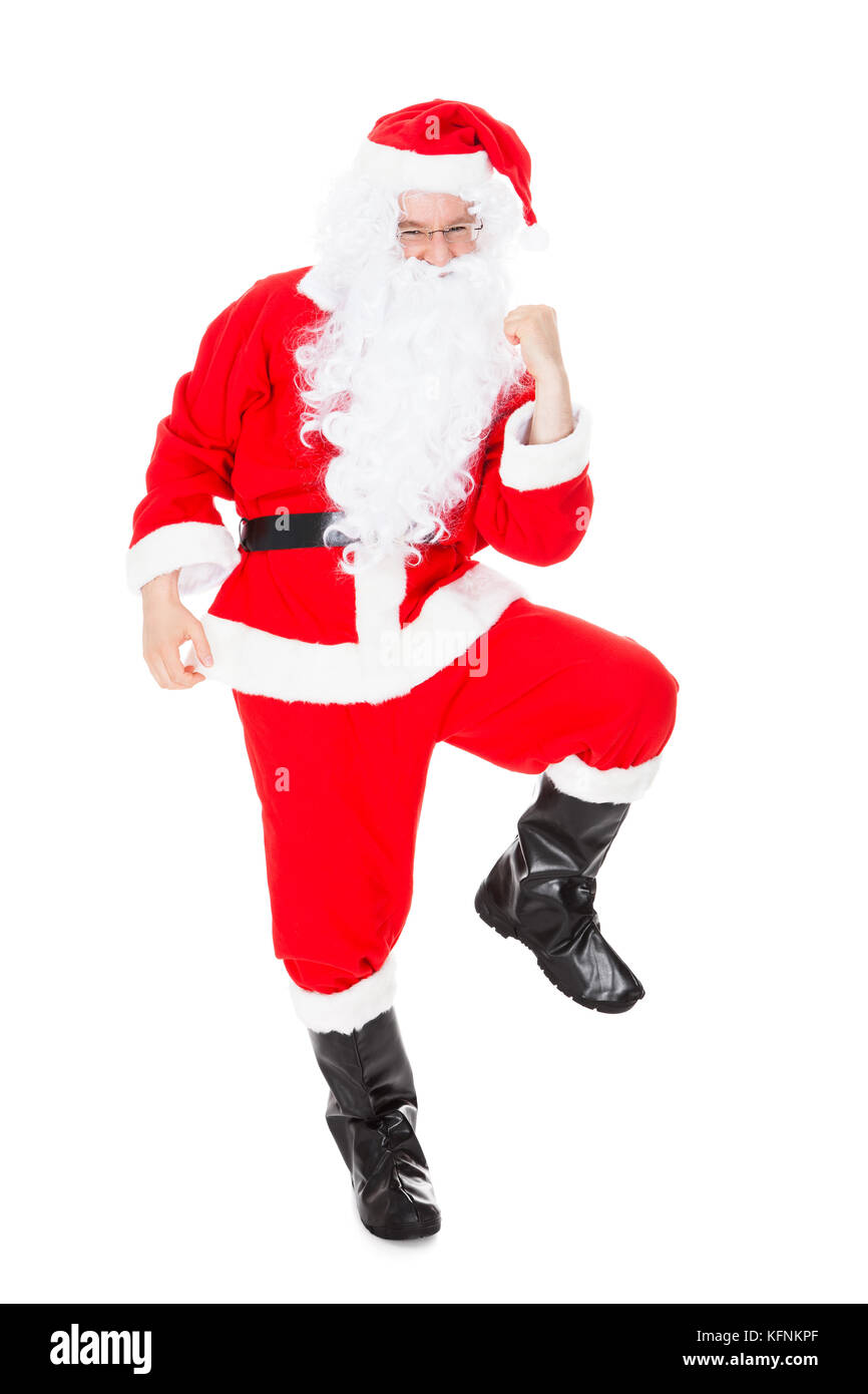 Portrait of excited santa raising his arms on white background Stock ...