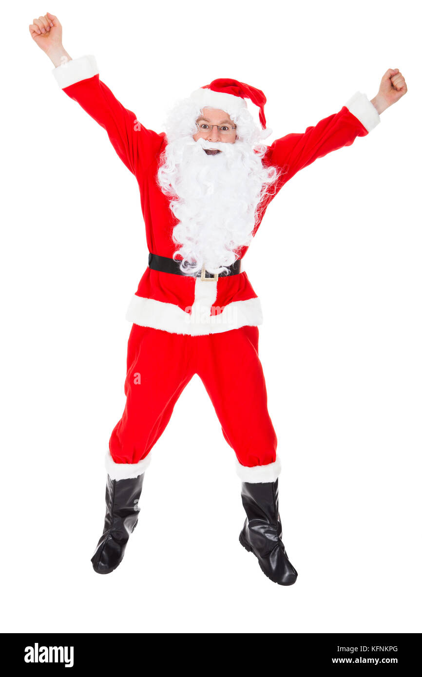 Portrait of excited santa raising his arms on white background Stock ...
