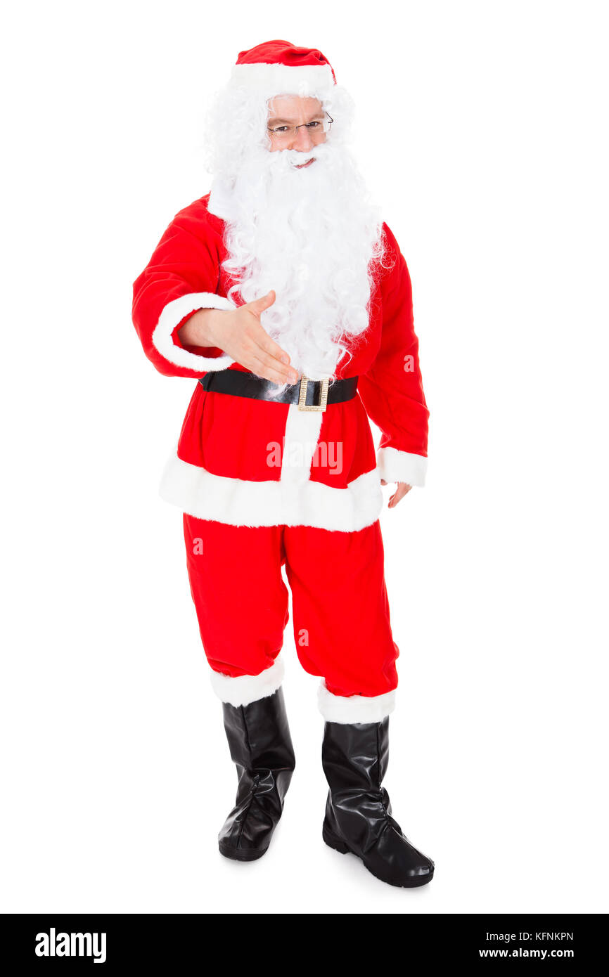 Portrait of santa offering hand shake over white background Stock Photo ...