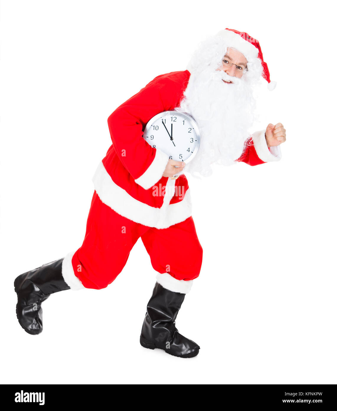 Santa running with clock isolated on white background Stock Photo - Alamy