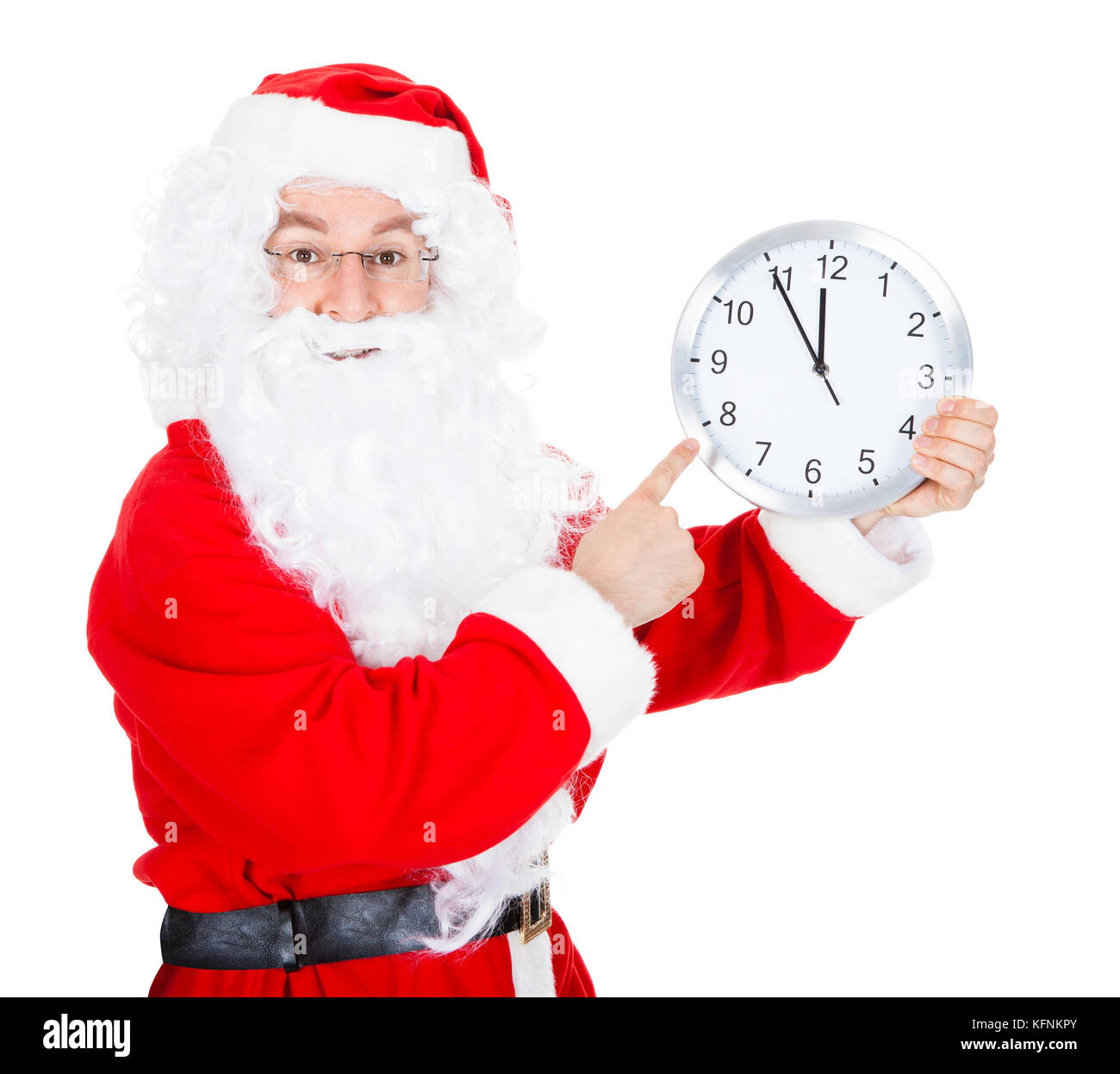 Santa Pointing At Clock Showing Time Over White Background Stock Photo ...