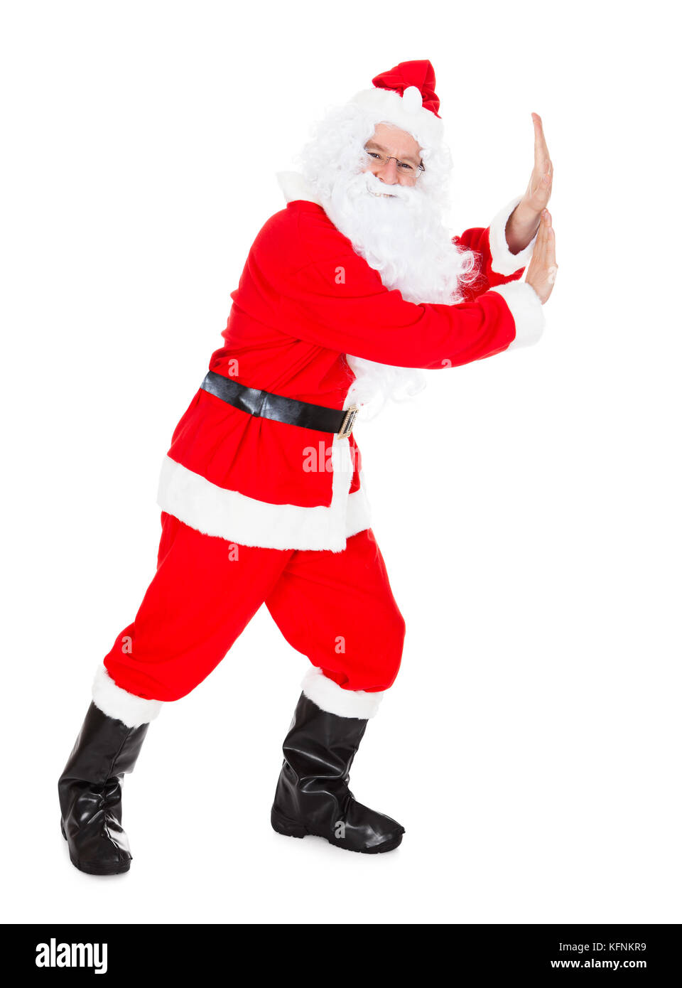 Happy Santa Claus Pushing Something Over A White Background Stock Photo ...