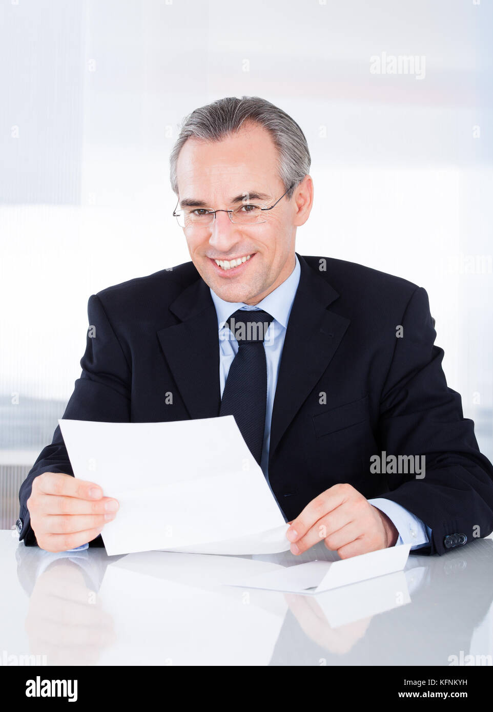 Successful man holding document hi-res stock photography and images - Alamy