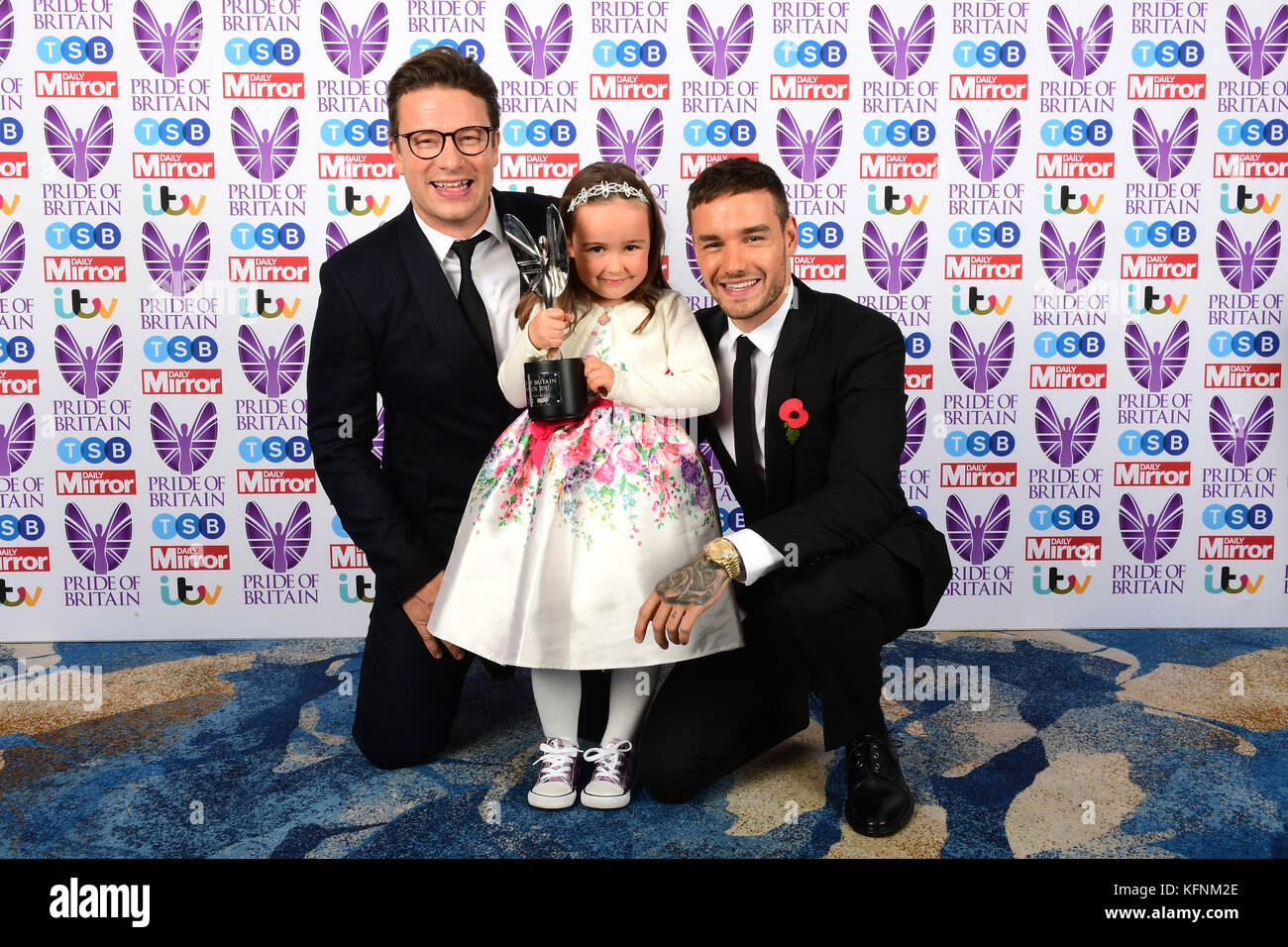 Liam Payne (right) and Jamie Oliver present Suzie McCash with the Child ...