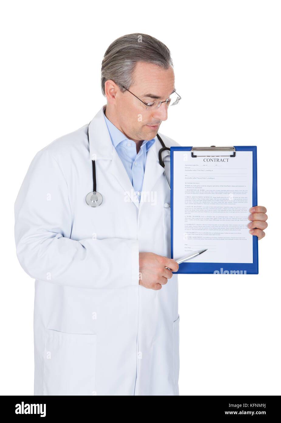 Portrait of a happy doctor writing on clipboard Stock Photo - Alamy