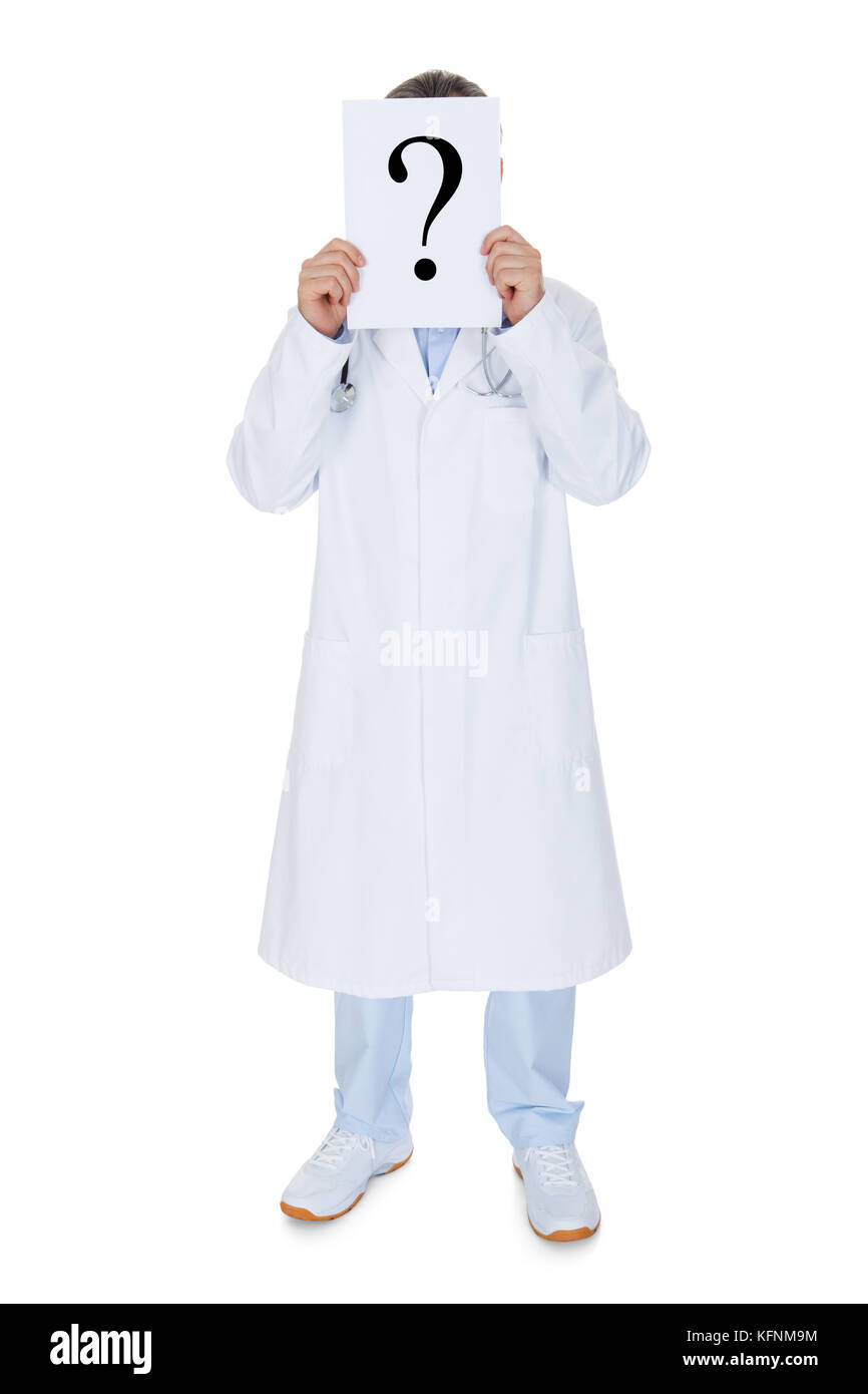 Portrait of doctor holding paper with question mark isolated on white ...