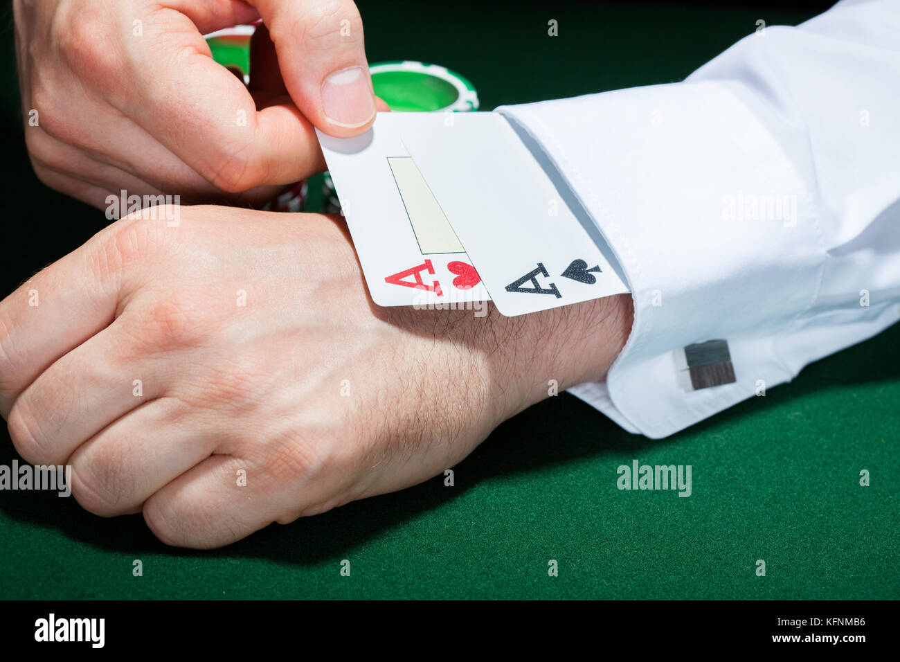 Close-up of human hand with playing cards in sleeve Stock Photo - Alamy