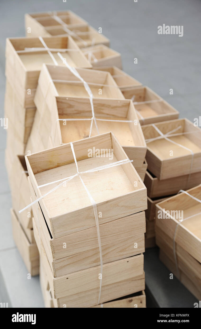 Square wooden boxes, connected by a rope Stock Photo - Alamy