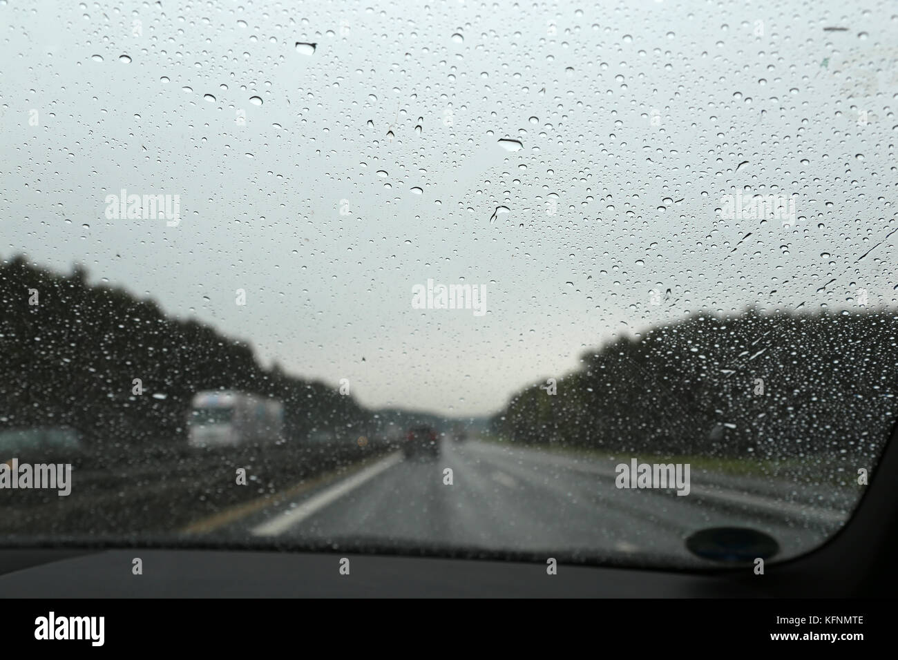 Bad weather on the Autobahn / Text on signs in German: traffic jam ...