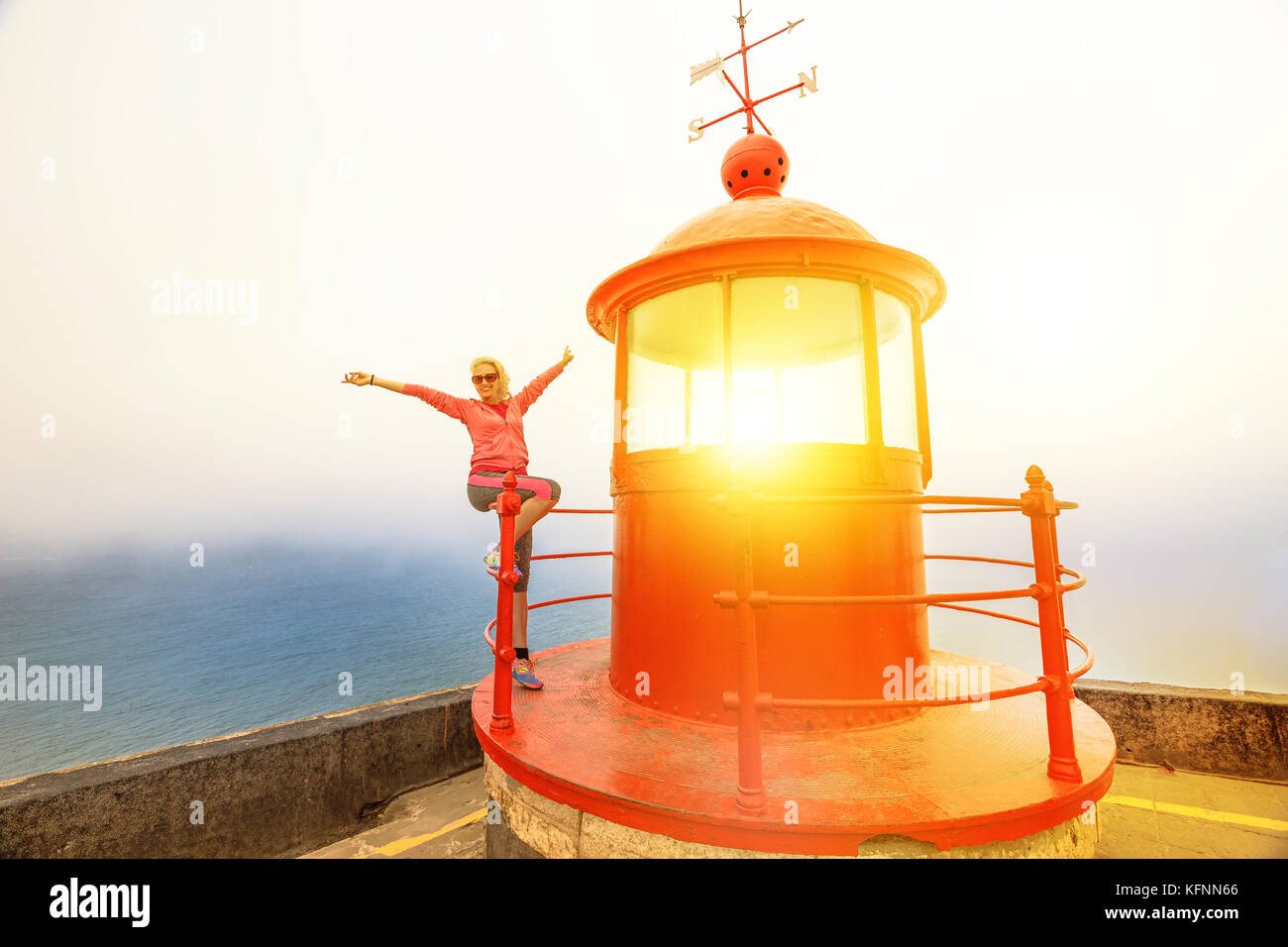 Woman at Nazare Lighthouse Stock Photo - Alamy