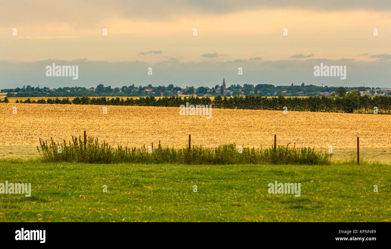 French countryside landscape with a small village in the distance and ...