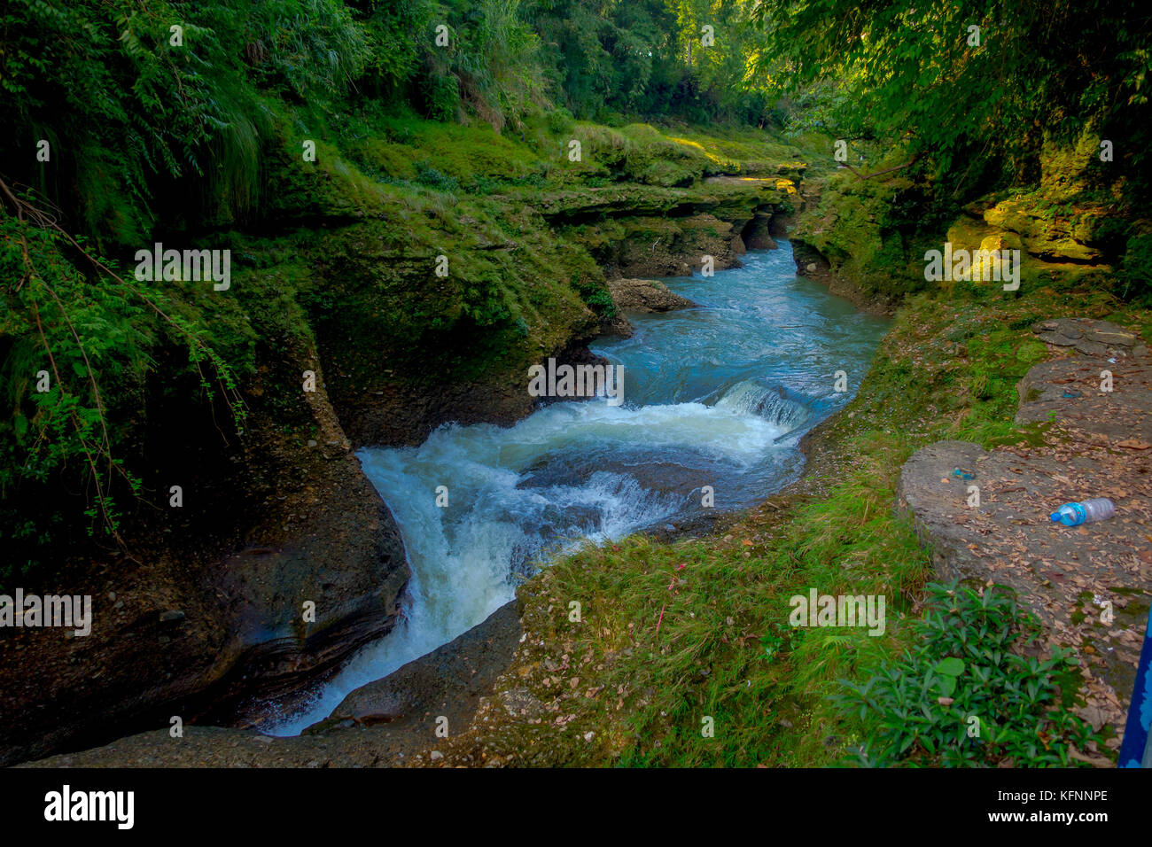 Water flows downstream to Devi's Falls in Pokhara, Nepal Stock Photo ...