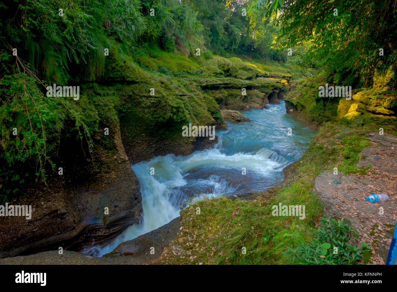 Water flows downstream to Devi's Falls in Pokhara, Nepal Stock Photo ...