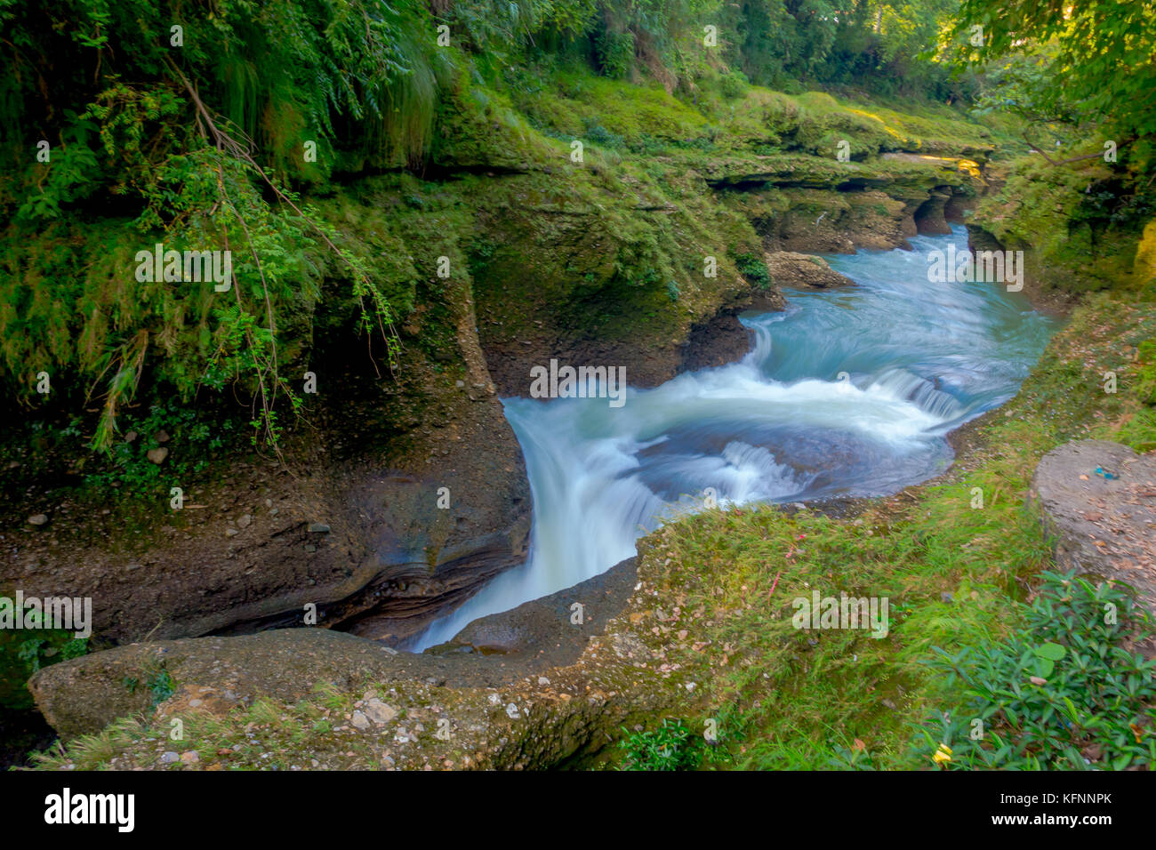 Water flows downstream to Devi's Falls in Pokhara, Nepal Stock Photo ...