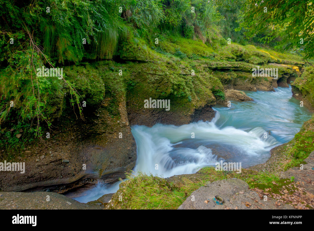 Water flows downstream to Devi's Falls in Pokhara, Nepal Stock Photo ...
