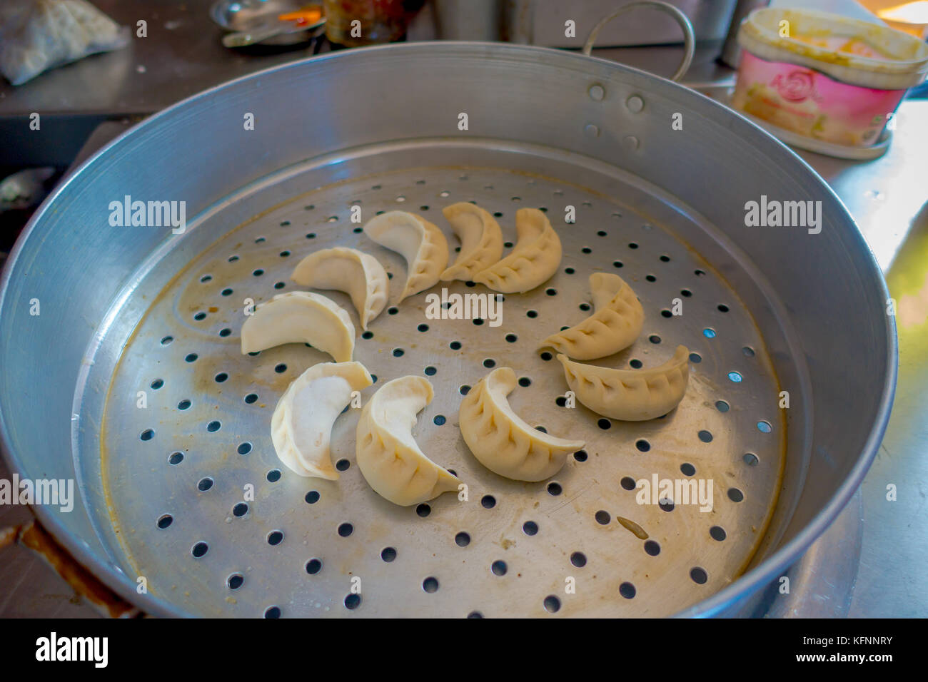 Delicious momo food over a metallic tray in the kitchen, type of South ...