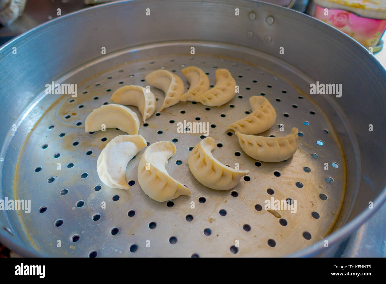 Delicious momo food over a metallic tray in the kitchen, type of South ...