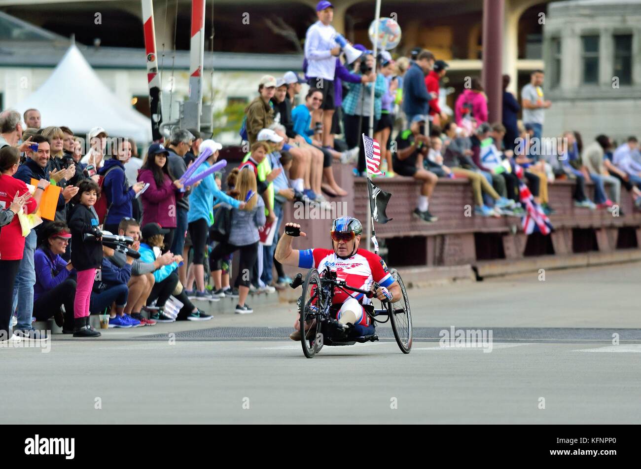 A patriotic US Handcycle athlete crossing the State Street Bridge ...