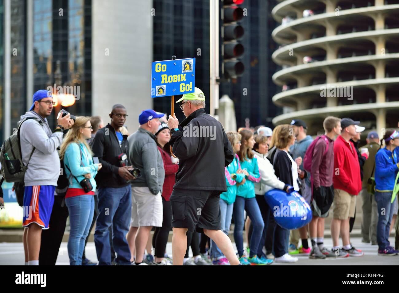 Supportive fan joining spectators along the State Street Bridge at the ...