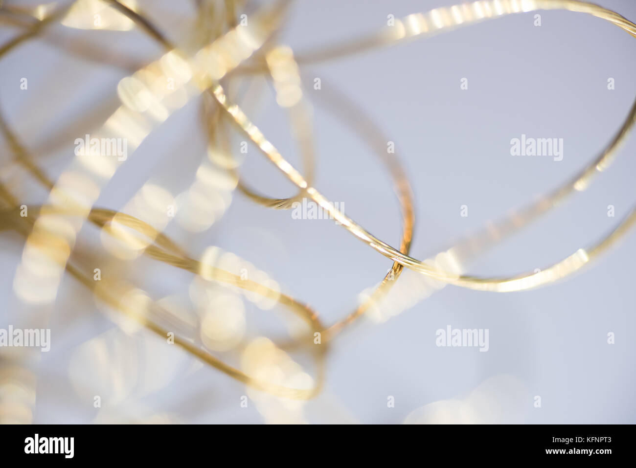 Golden wire knot Stock Photo - Alamy