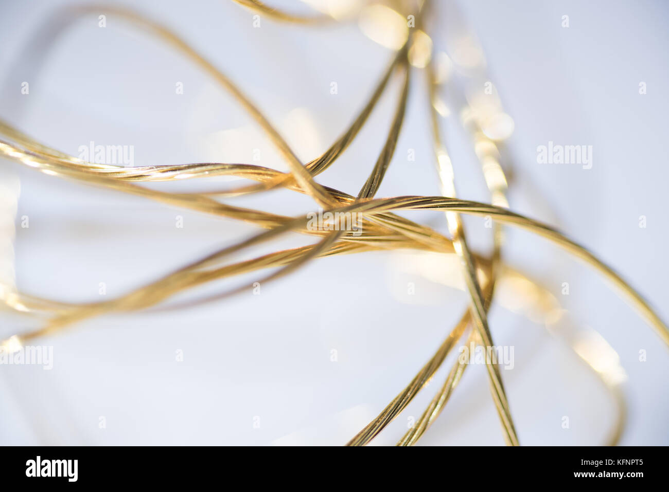 Golden wire knot Stock Photo - Alamy