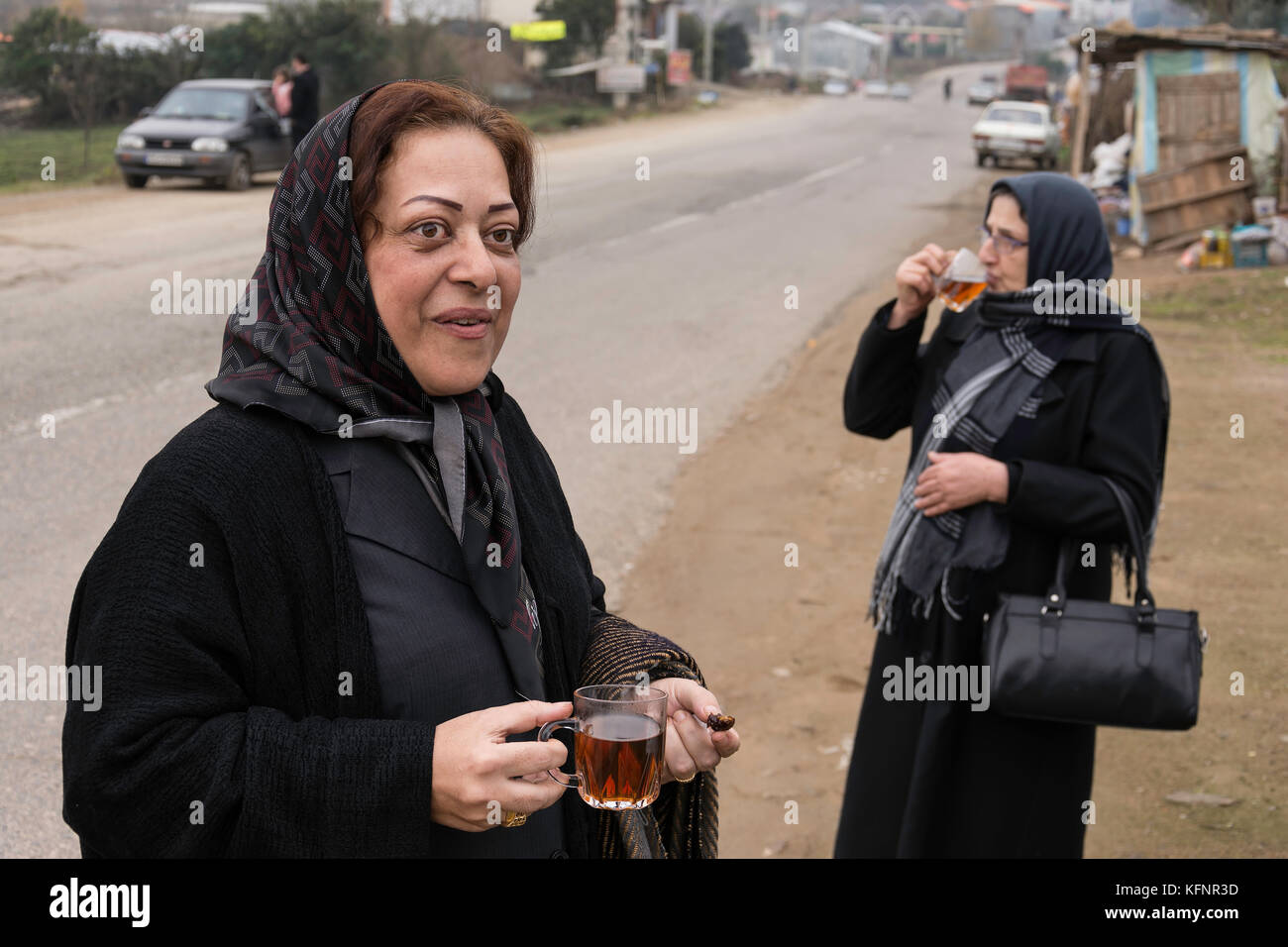 Two Muslim Woman drinking Tea at Beside of Street Stock Photo - Alamy