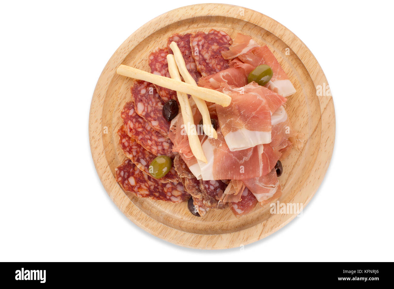 Dry-cured pork slices on wooden plate isolated Stock Photo - Alamy