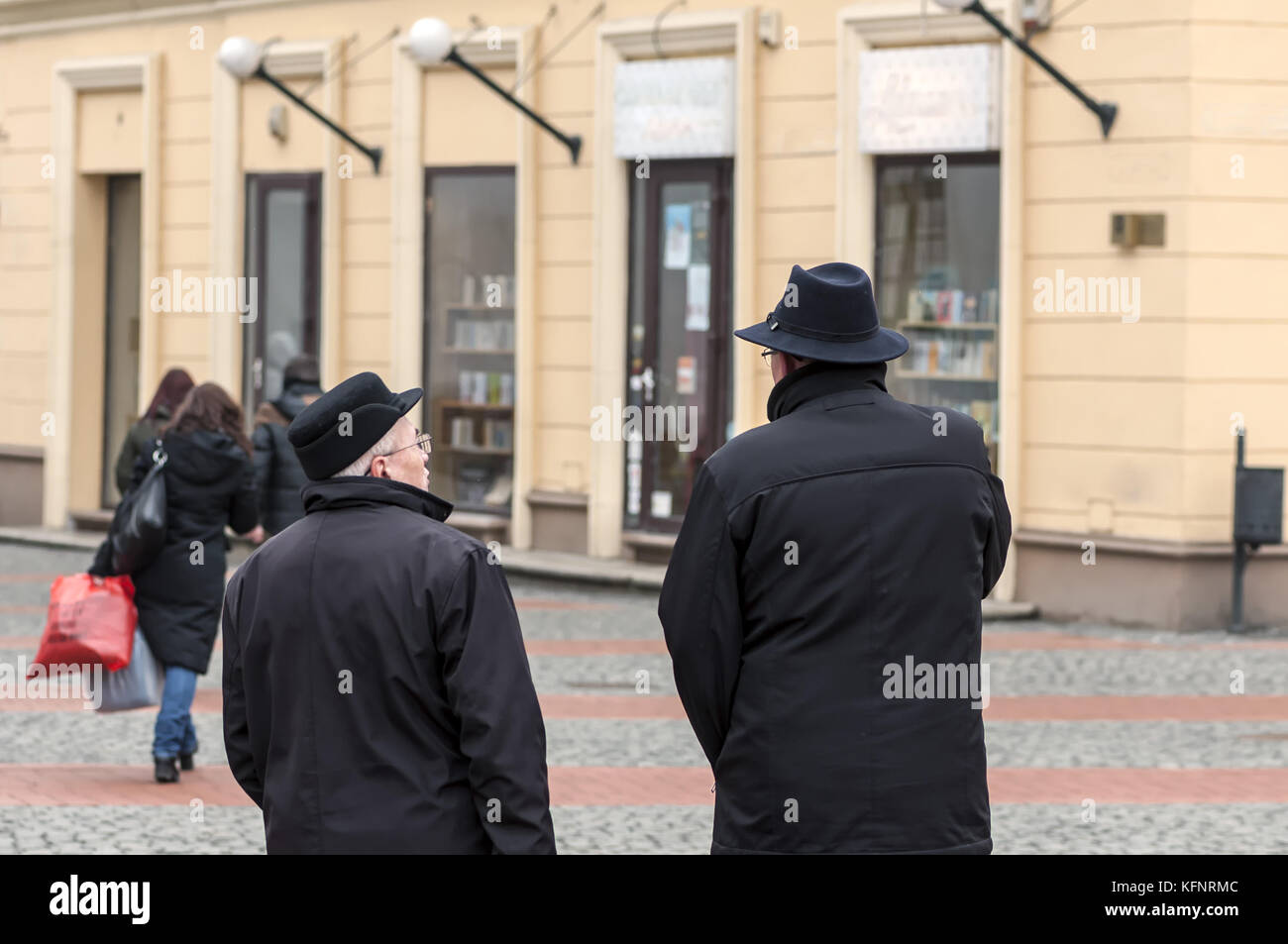 Two elderly people talking. Rear view. From behind. Real people. Head ...